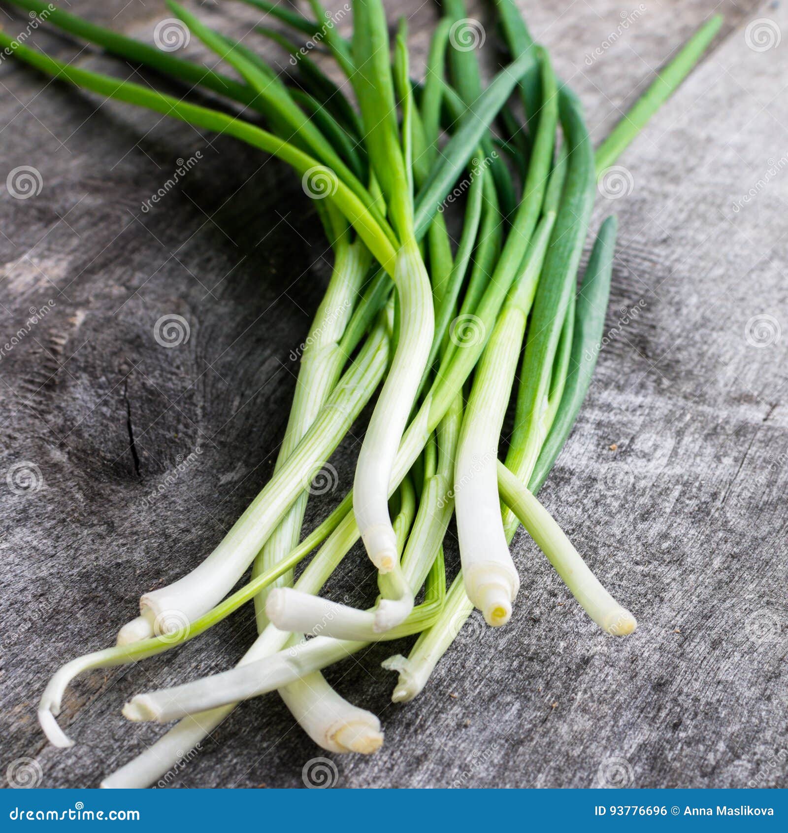 Green Young Onion on the Wooden Table. Rustic Style. Square Stock Photo ...