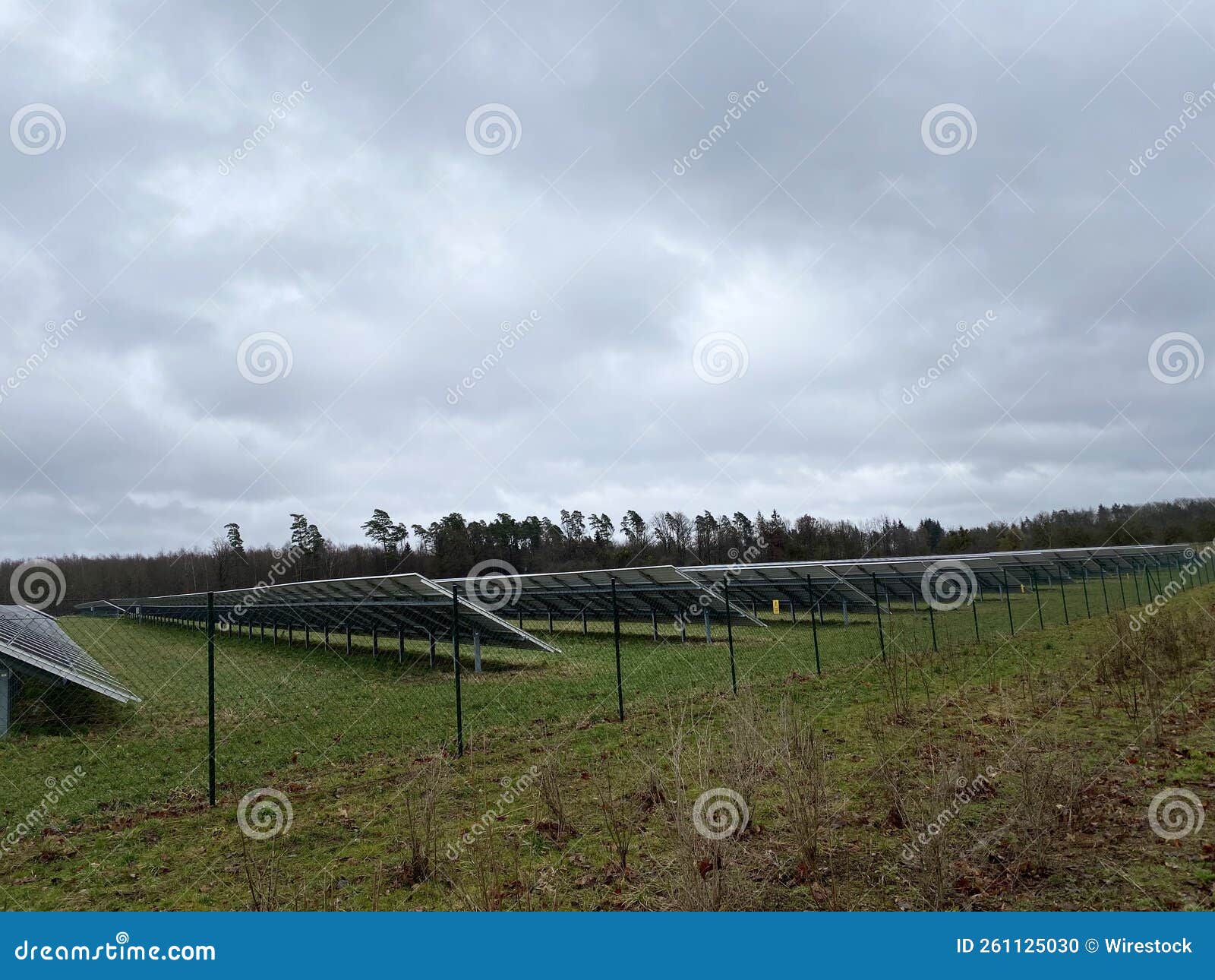 Greenfield with Solar Panels on a Cloudy Day Stock Photo - Image of ...