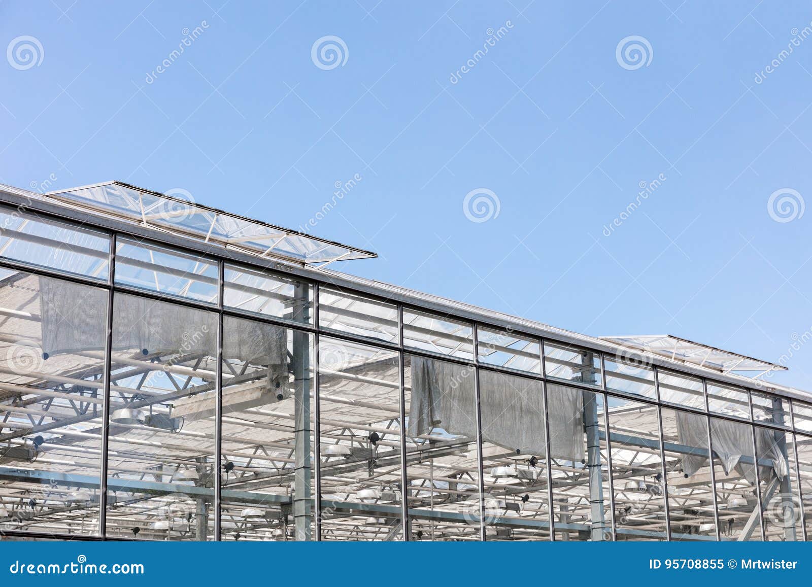 Greenhouse with Open Windows for Ventilation Against Blue Sky Stock ...