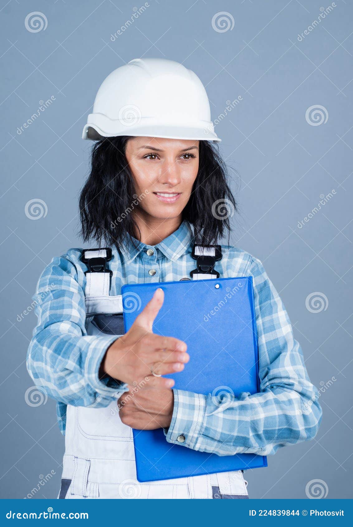 Greeting or Welcome. Girl in Workshop Uniform. Engineering. Architect ...