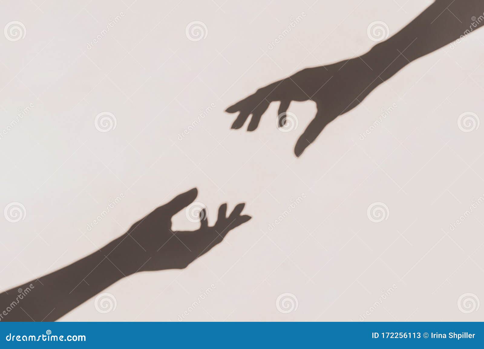 Grey Shadows of Hands Reaching Each Other on the Wall. Abstract Blurred ...