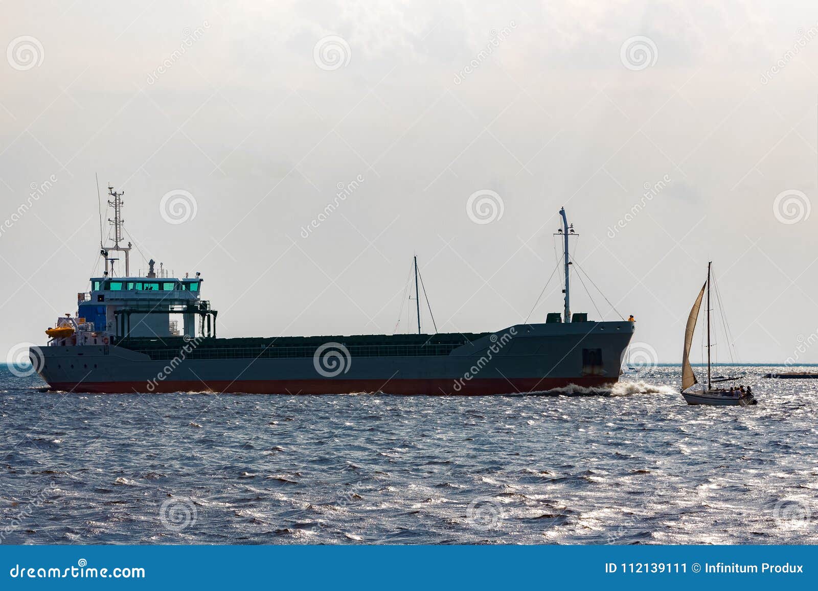 Grey cargo ship stock image. Image of blue, calm, sailing - 112139111