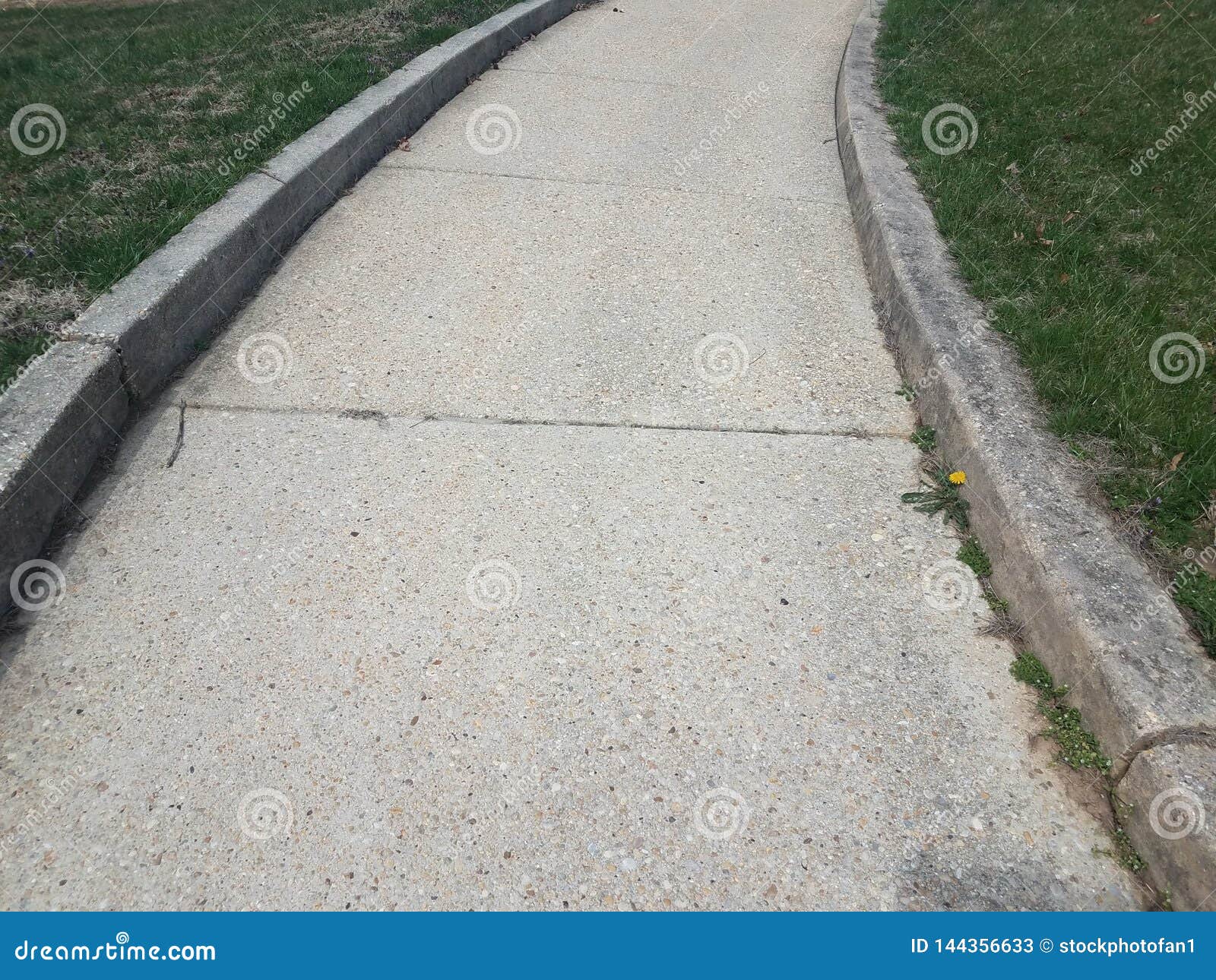 Grey Cement Sidewalk or Path with Curb and Green Grass Stock Image ...