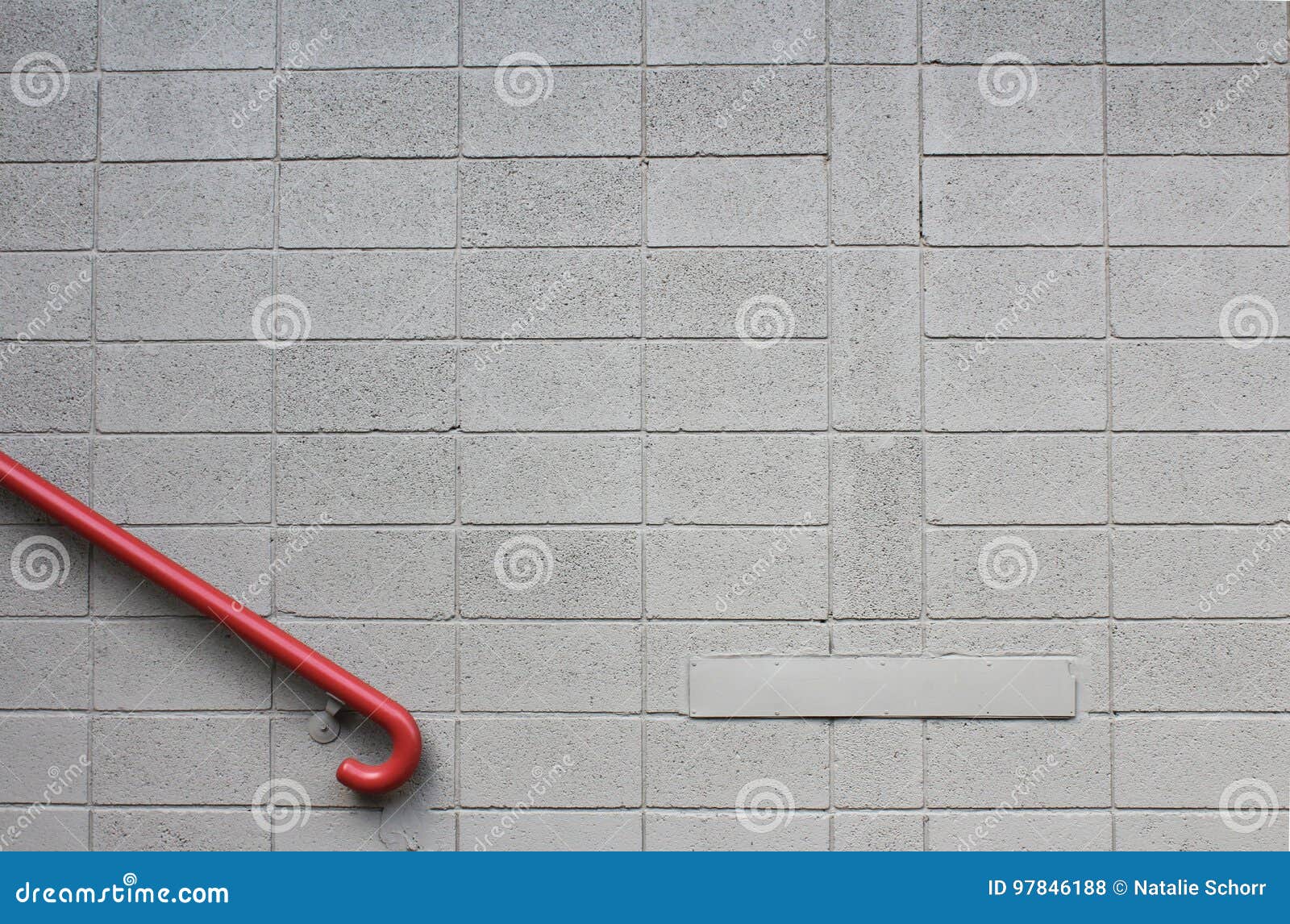 Grey Cinder Block Wall with Red Hand Rail Stock Photo - Image of shadow ...