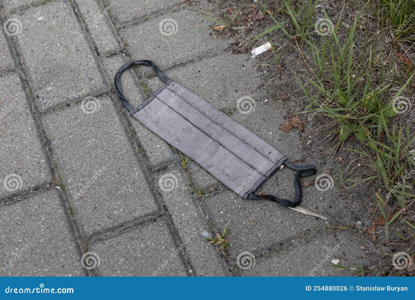 Grey Cloth Face Mask, Flattened on the Street Trash Stock Photo - Image ...