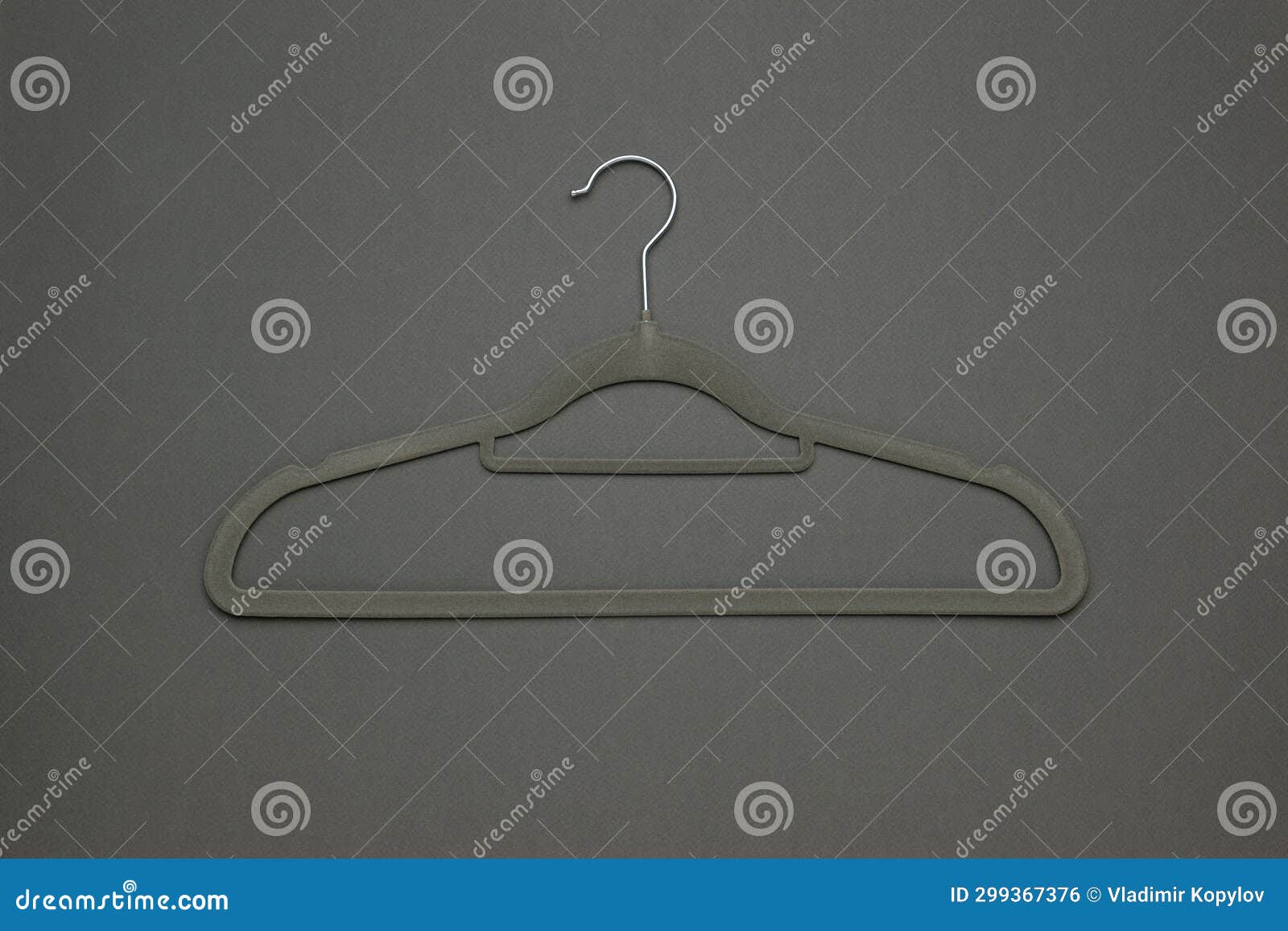 Grey Clothes Hanger on a Grey Background Stock Photo - Image of clothes ...