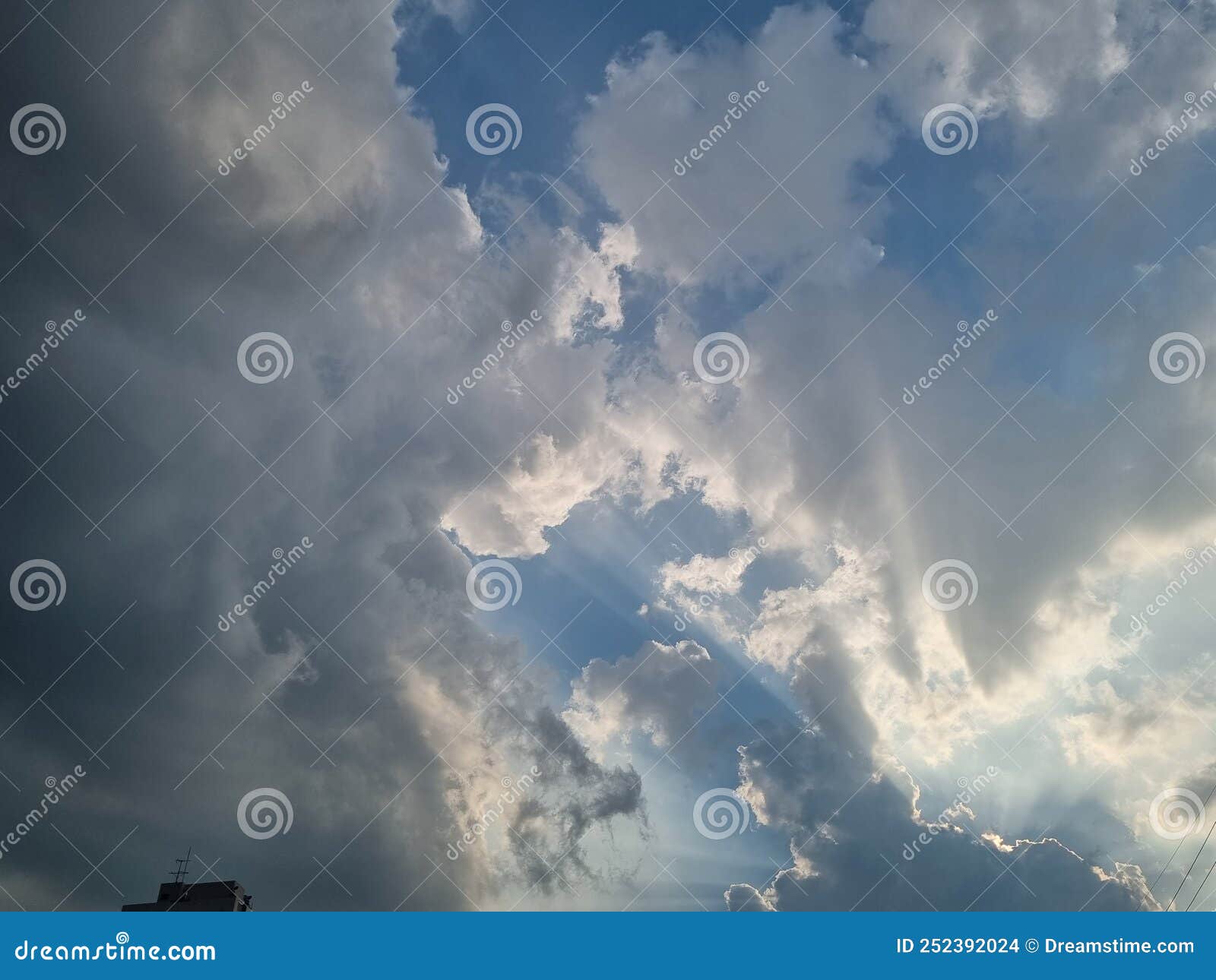 Grey cloud with sun ray stock photo. Image of daytime - 252392024