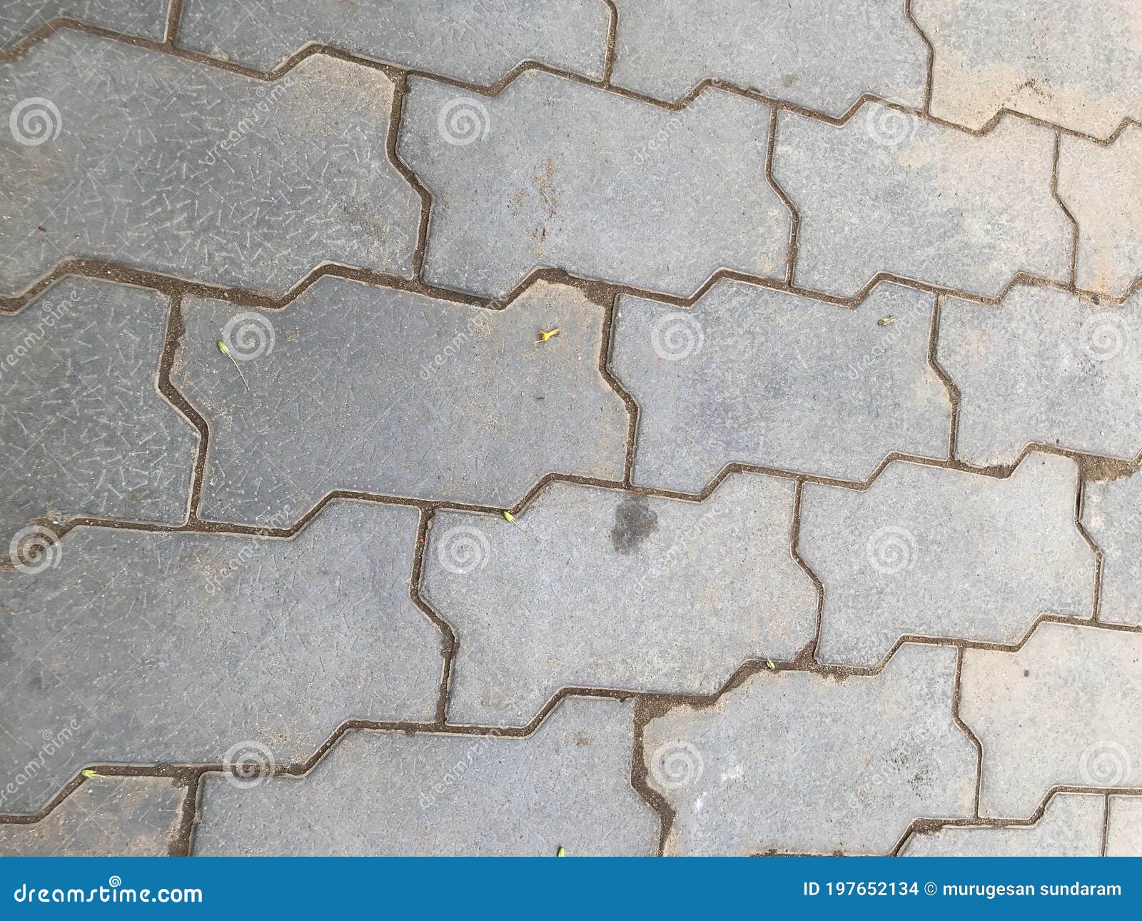 Grey Color Interlocking Tiles Pattern Background Tiles In The Streets ...