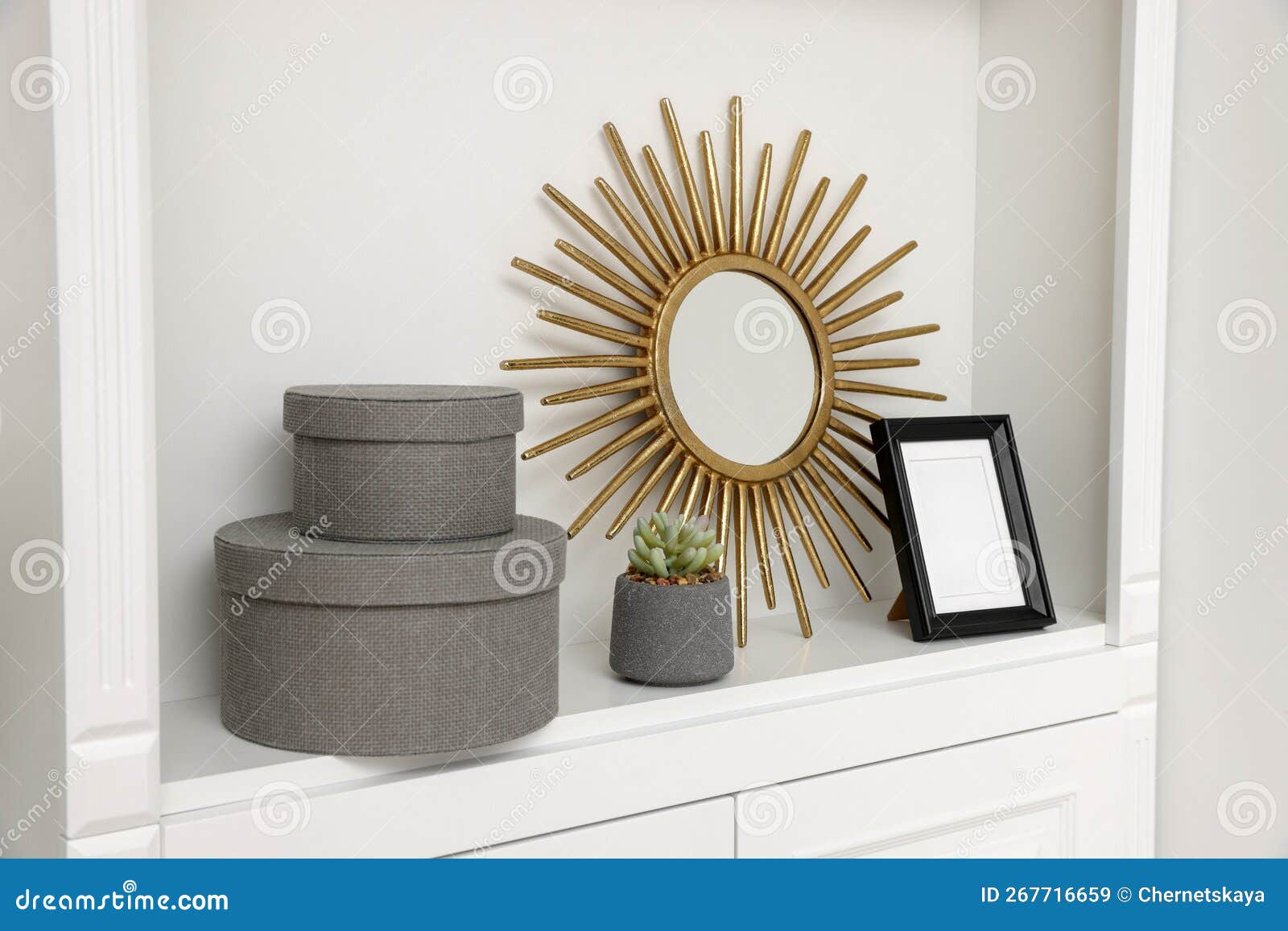 Grey Decorative Boxes, Houseplant, Mirror and Frame on Shelving Unit ...