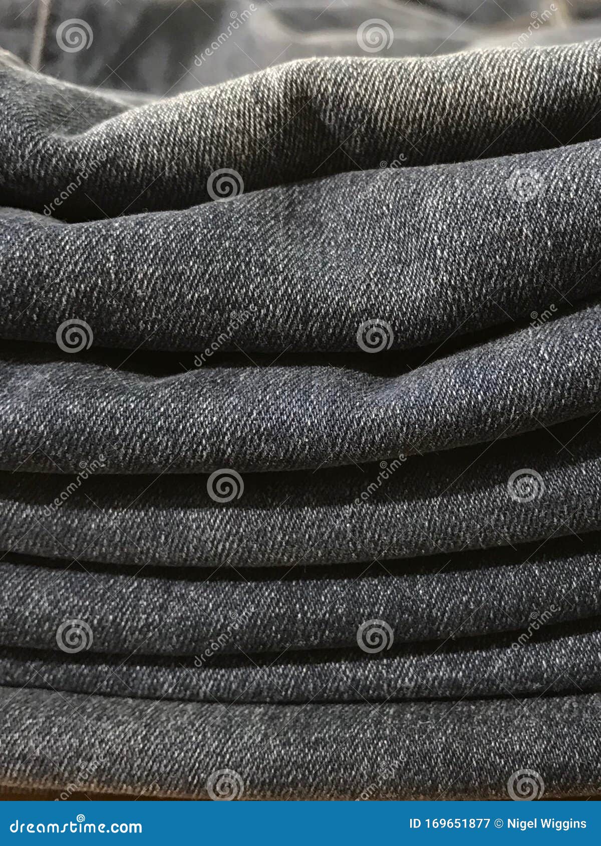 Grey Denim material folded stock image. Image of close - 169651877