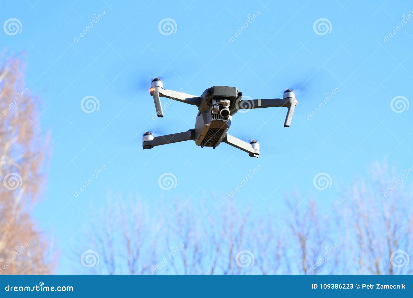 Flying drone with camera stock image. Image of camera - 109386223