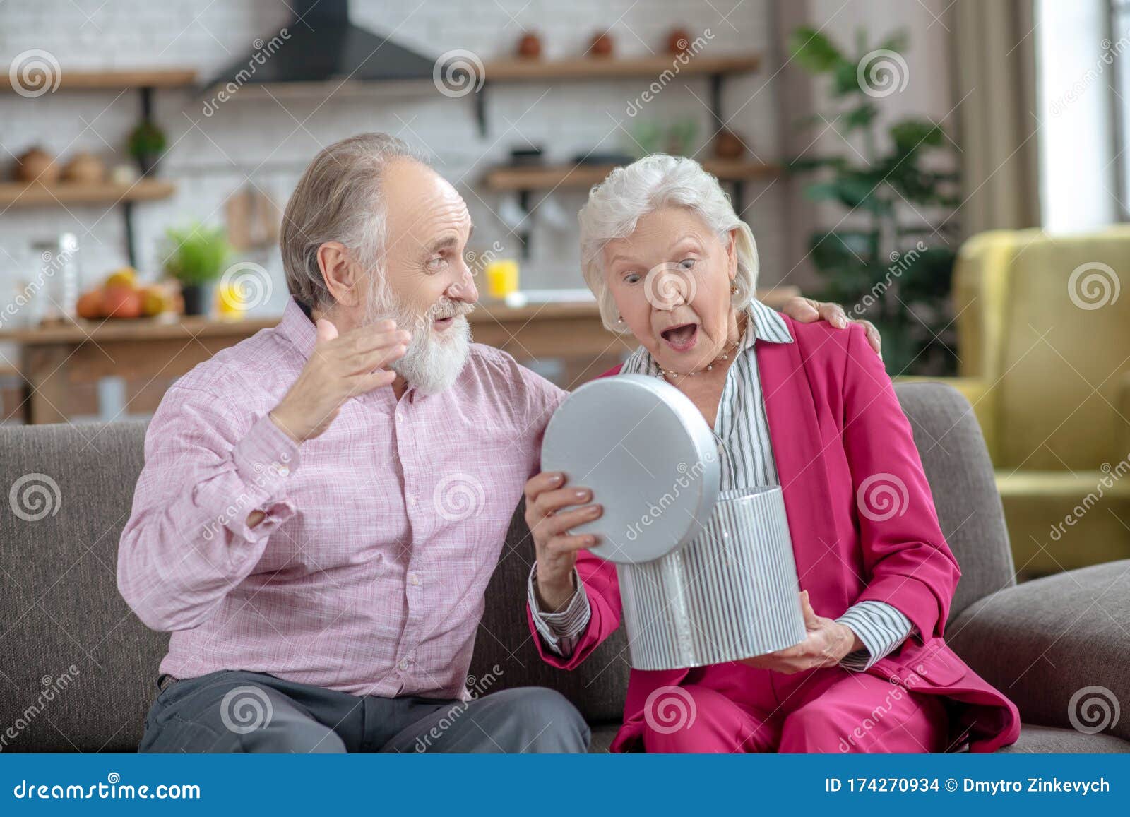 Grey-haired Elderly Lady Opening Gift Box and Looking Surprised Stock ...