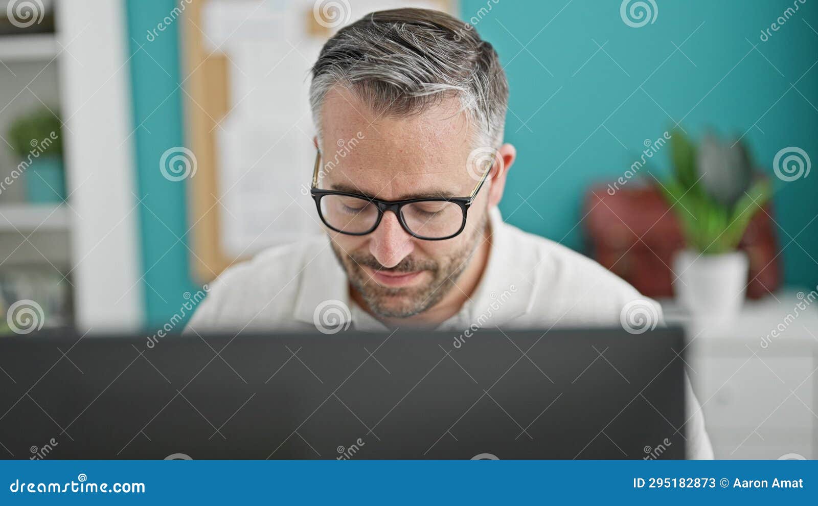 Grey-haired Man Business Worker Using Computer Thinking at the Office ...