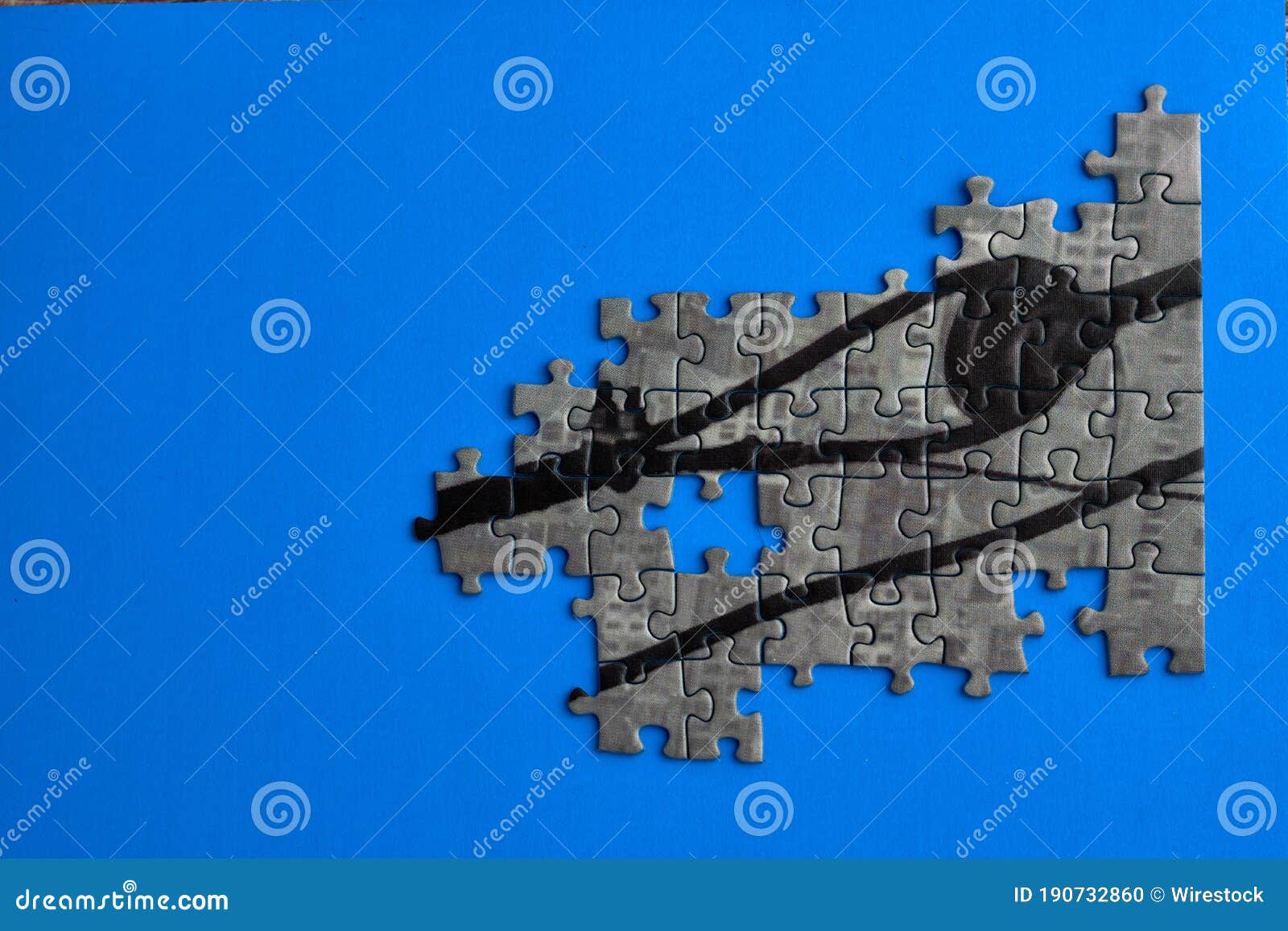 Grey Half-completed Puzzle on a Blue Background Stock Photo - Image of ...