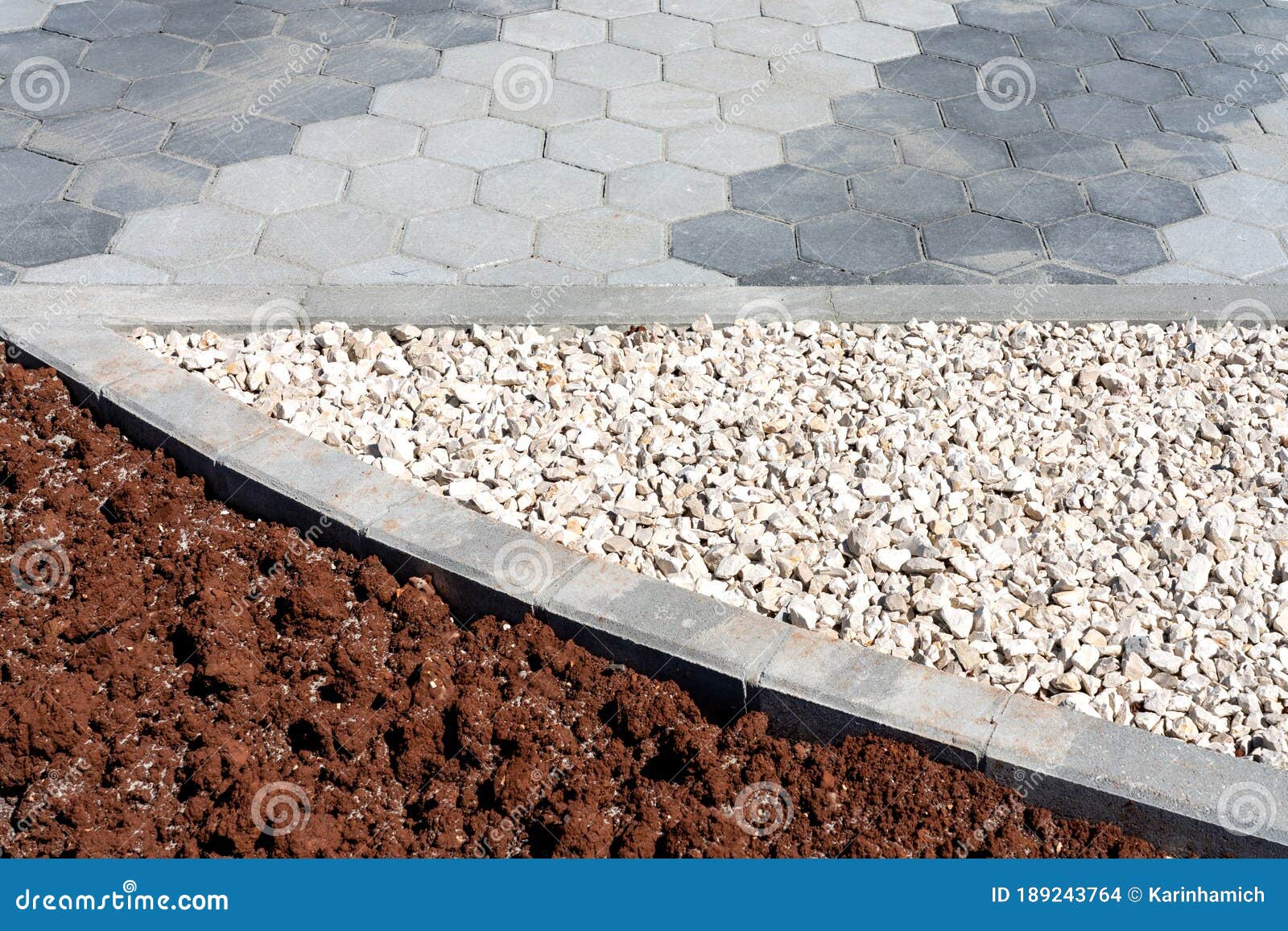 Grey Hexagonal Cobblestone Path Divided with Pebbles and Soil for Later ...