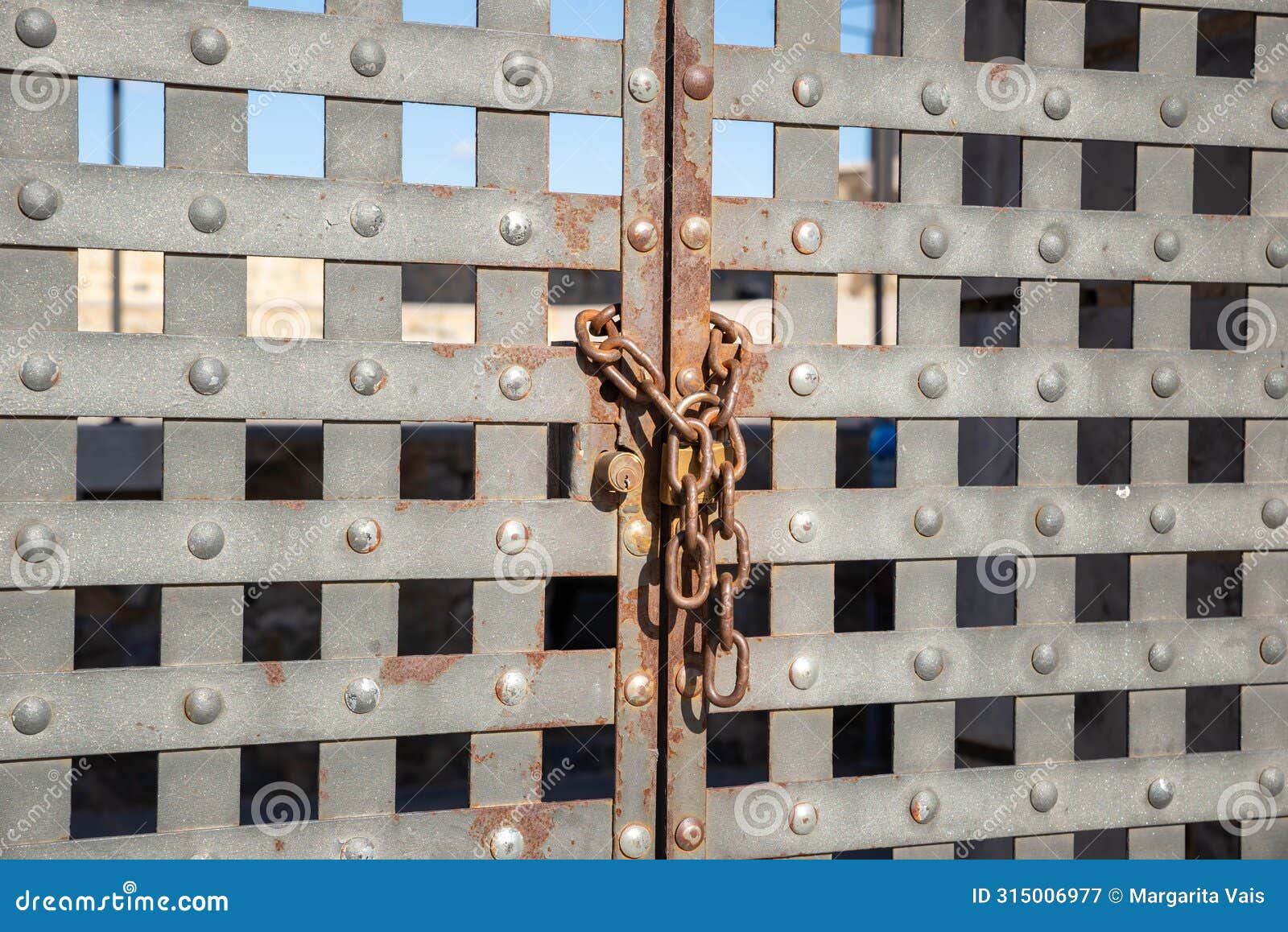 Grey Iron Gate Closed with Rusty Chain and Padlock Stock Image - Image ...