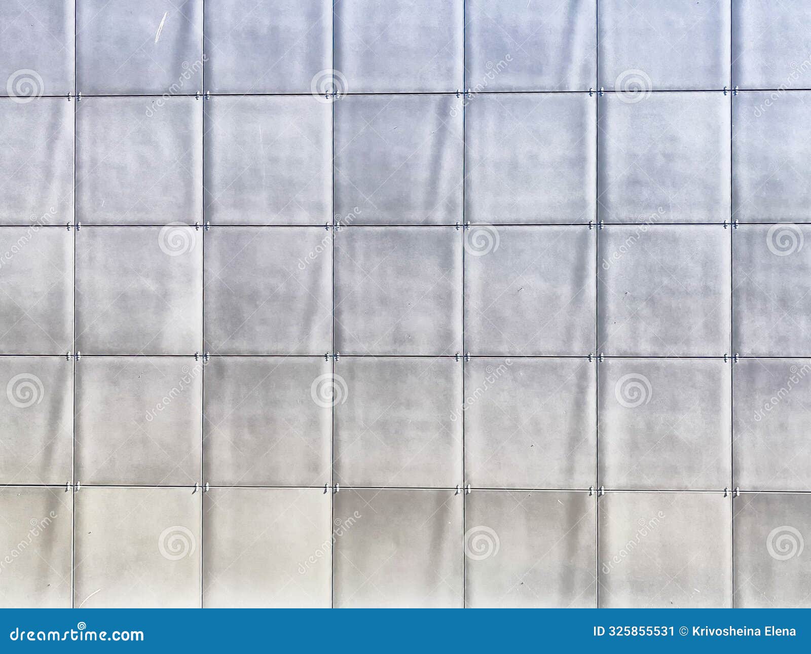 A Grey Metal Wall with Square Panels, Each Panel Held in Place by Small ...