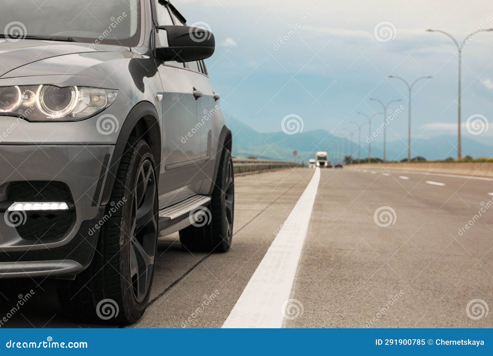 Grey Modern Car Parked on Asphalt Road Stock Image - Image of cloudy ...