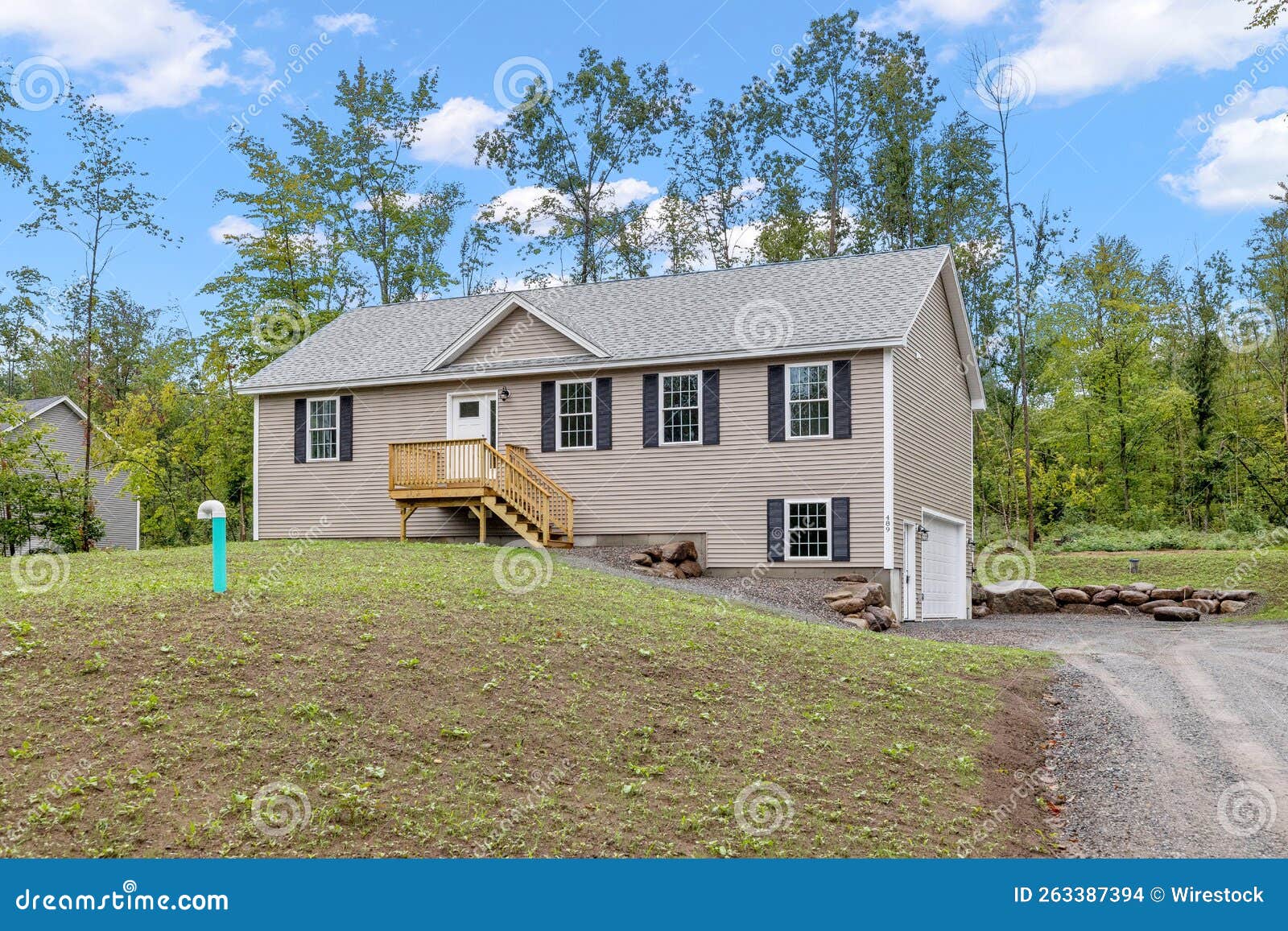 Grey Modern Construction of Contemporary Raised Ranch Surrounded by ...