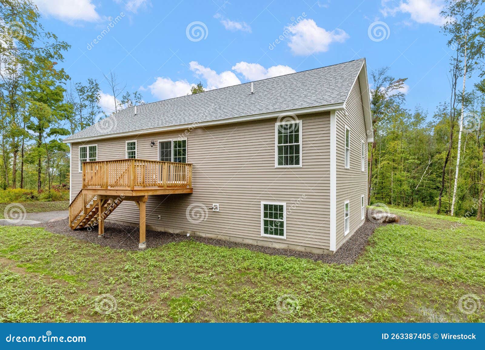 Grey Modern Construction of Contemporary Raised Ranch Surrounded by ...