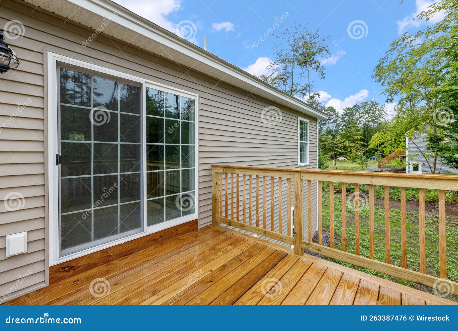 Grey Modern Construction of Contemporary Raised Ranch Surrounded by ...
