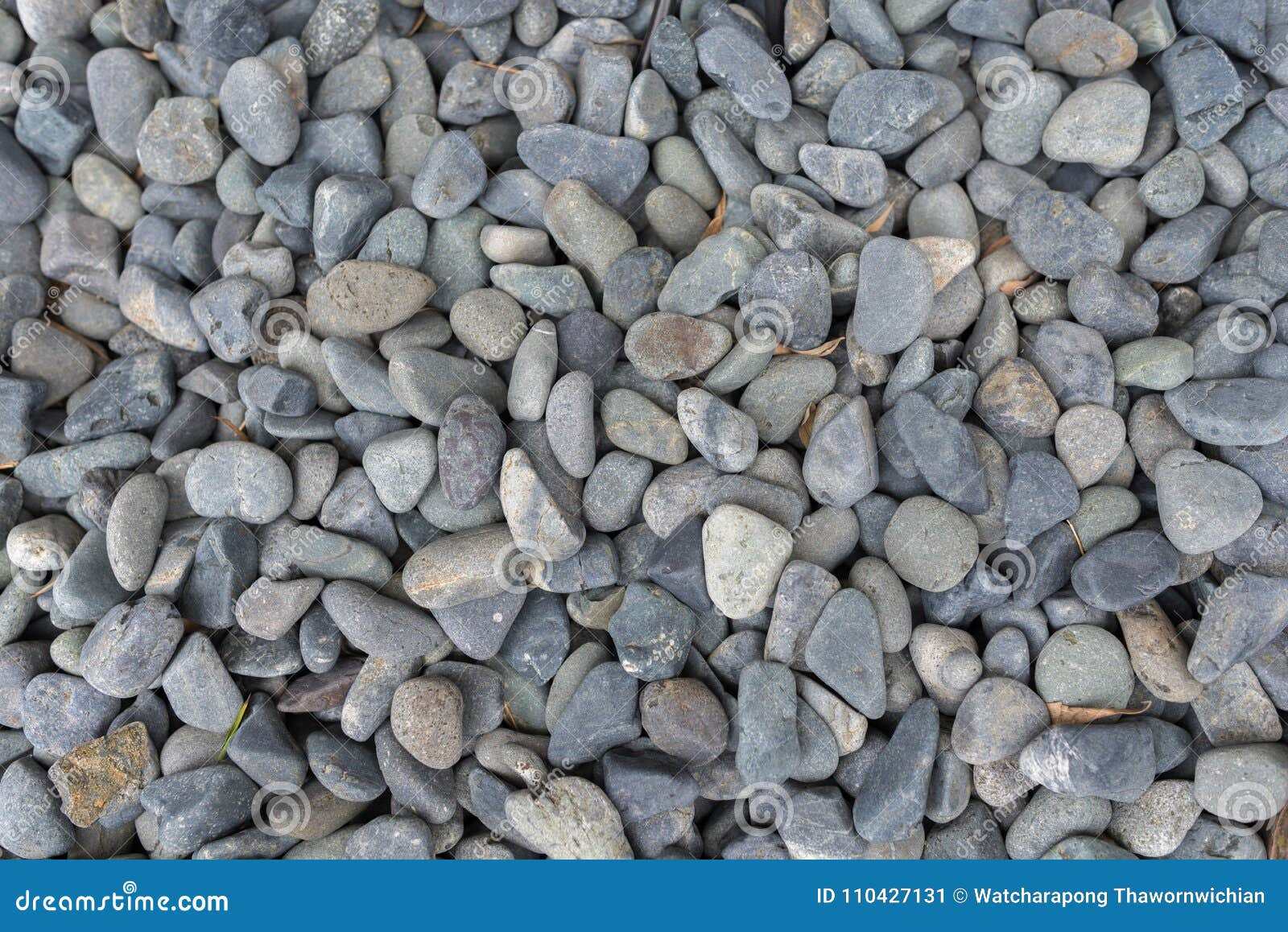 Grey pebbles on ground stock image. Image of pebble - 110427131
