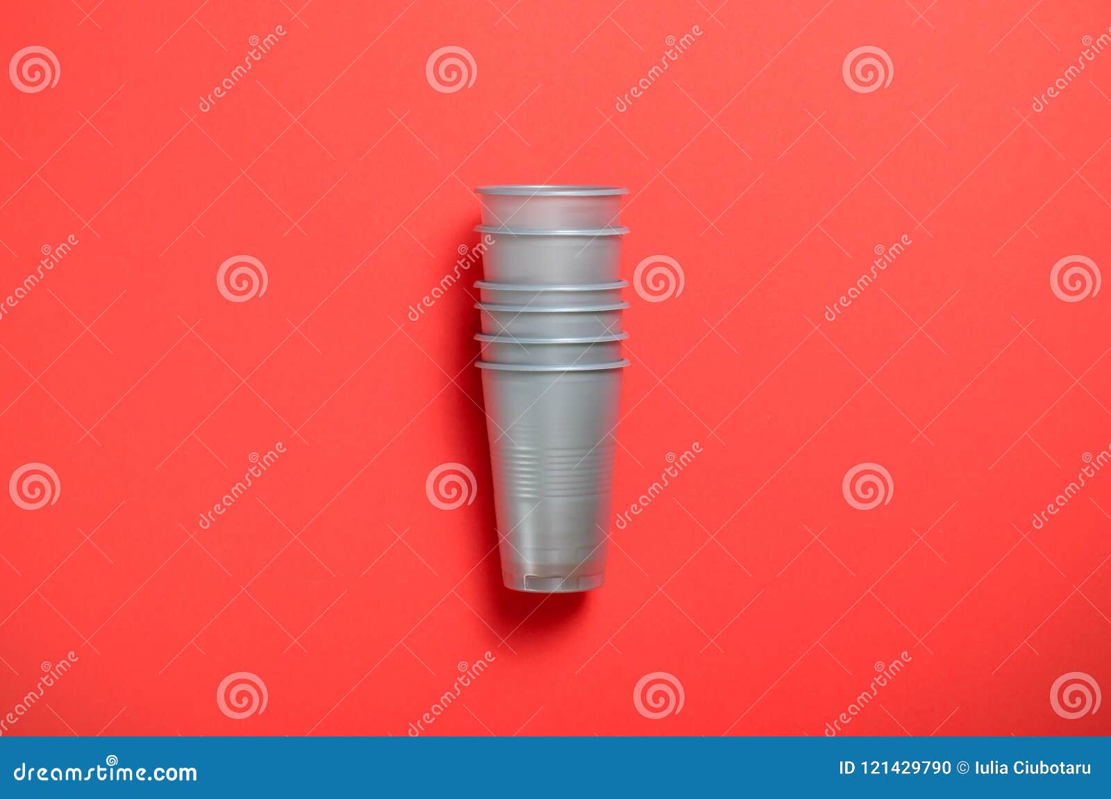 Grey Plastic Cups on Bright Orange Background, , Food Concept Stock ...