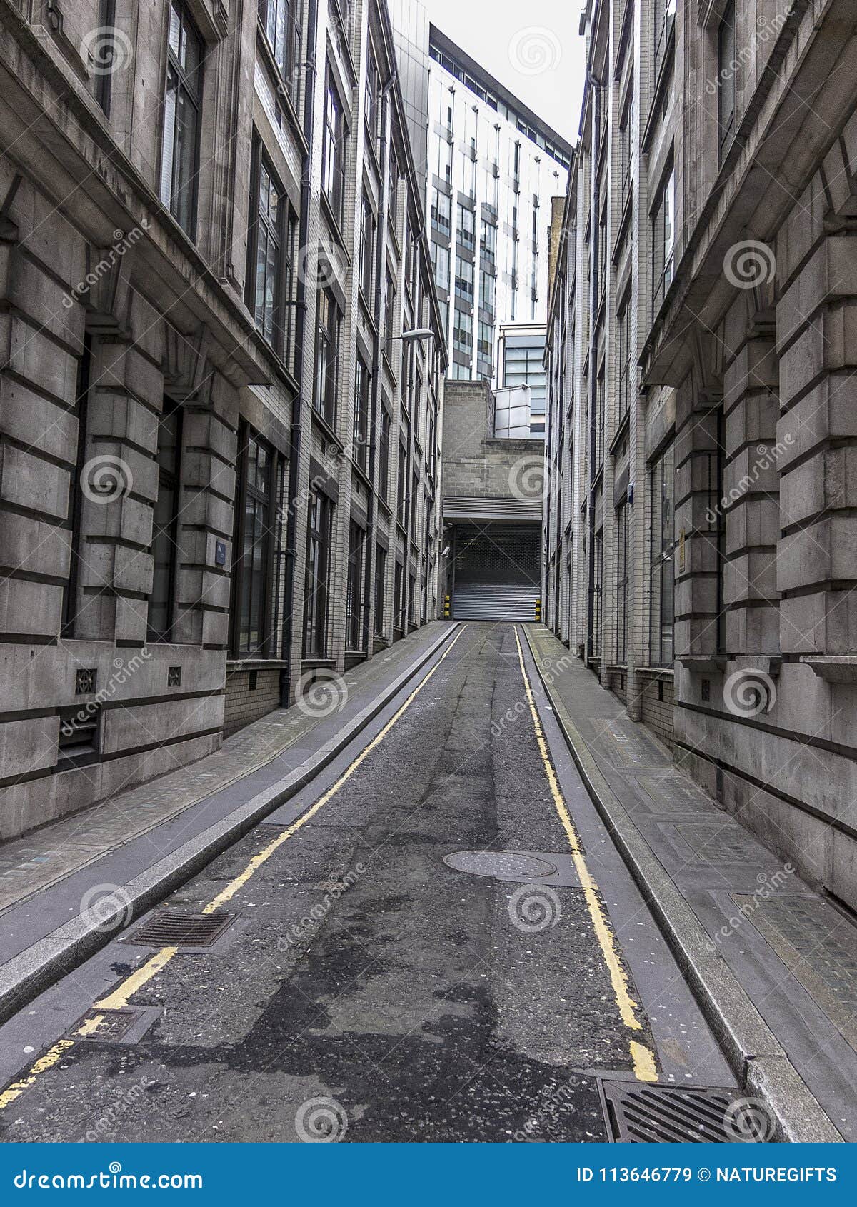 Road between Buildings stock image. Image of windows - 113646779