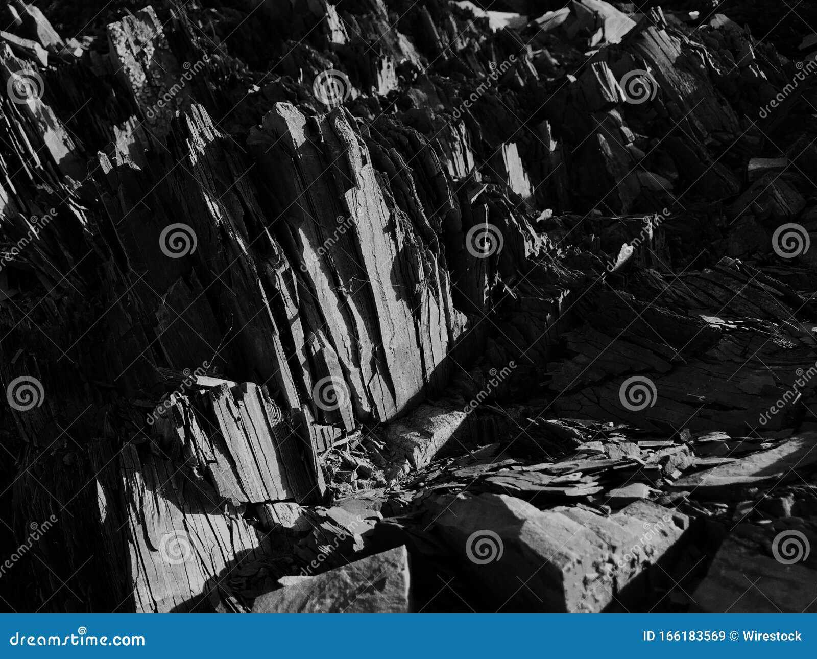 Grey Scale Shot of the Beautiful Layers of Old Rocks on a Mountain ...