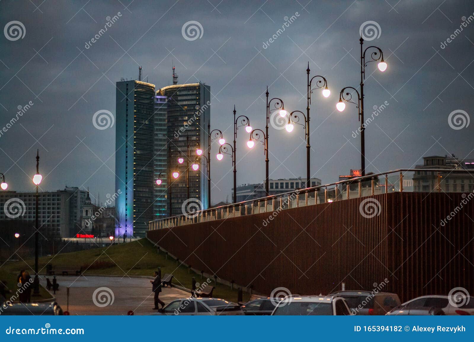 Grey Soviet Constructivist Building with Evening Illumination and Stret ...
