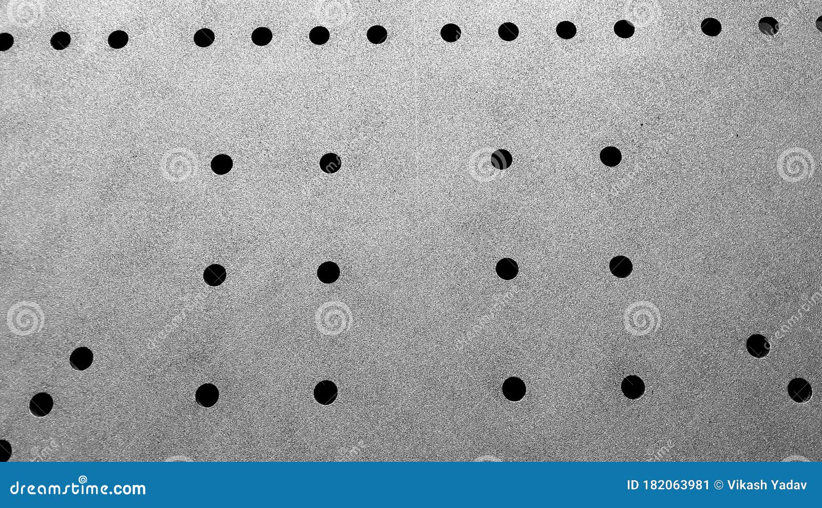 Grey Steel Surface After Grit Blasting Close Up With Drilled Holes