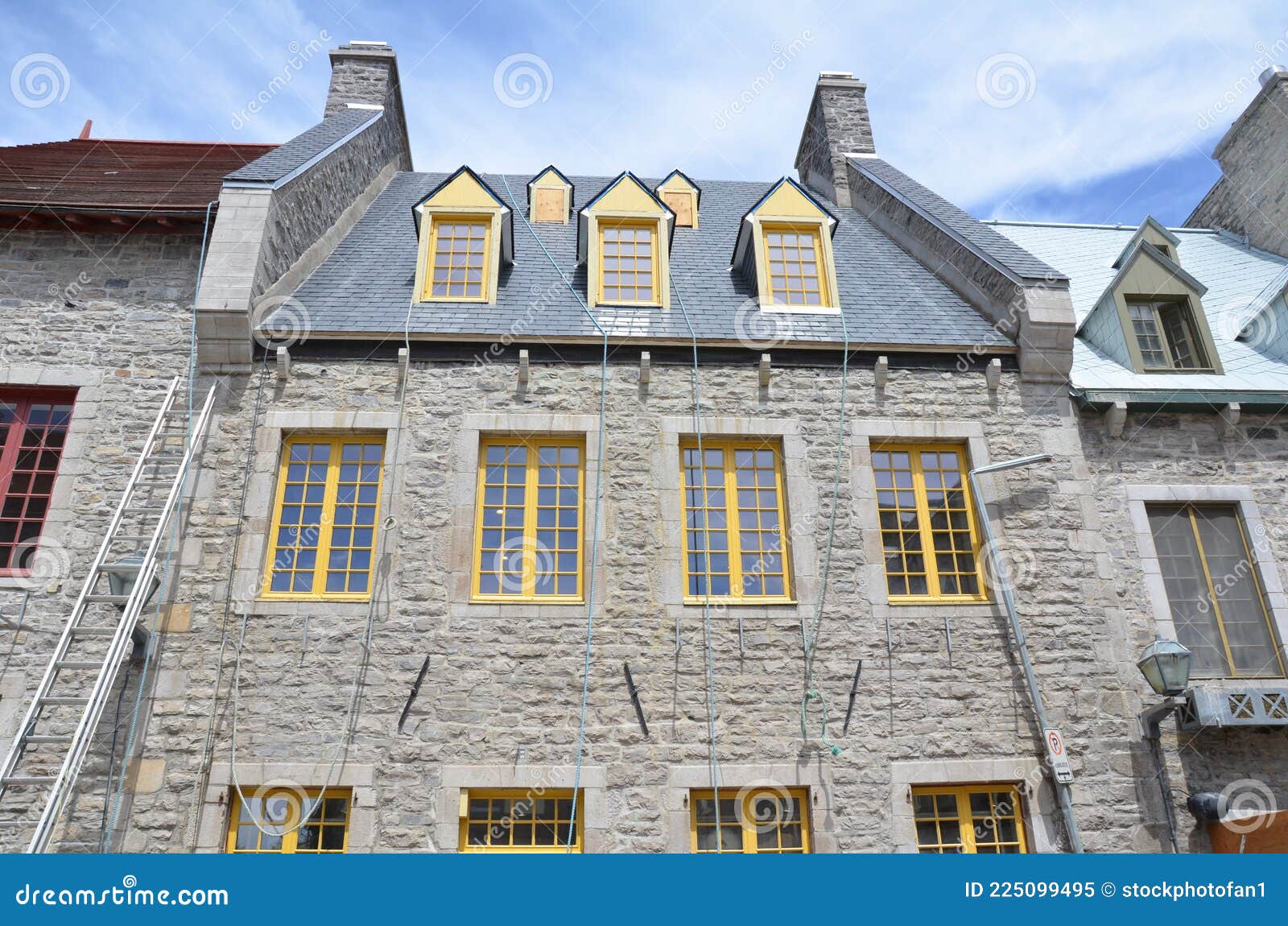 Grey Stone Building with Yellow Windows Under Construction Stock Image ...