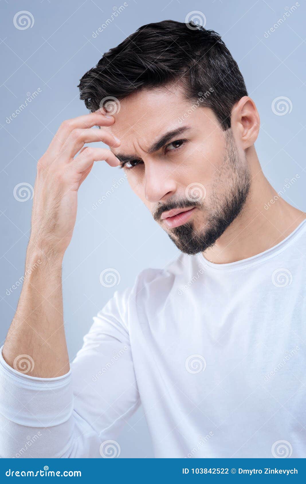 Concentrated Man Looking Worried while Standing and Frowning Stock ...