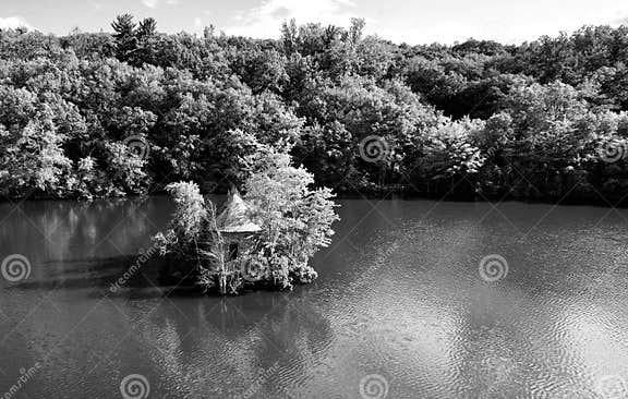 Greyscale of a River and a Building with a Forest in the Background ...