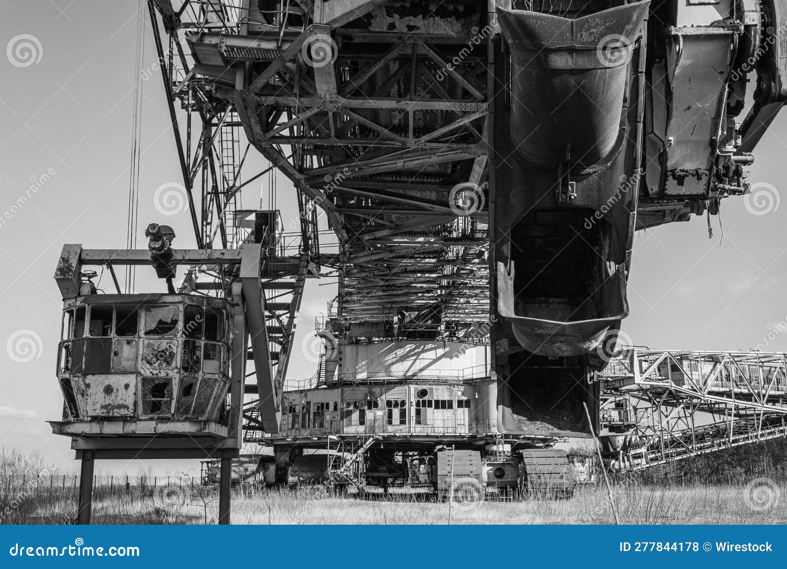 Greyscale of a Rusty Old Excavator with Rust and a Clear Blue Sky in ...