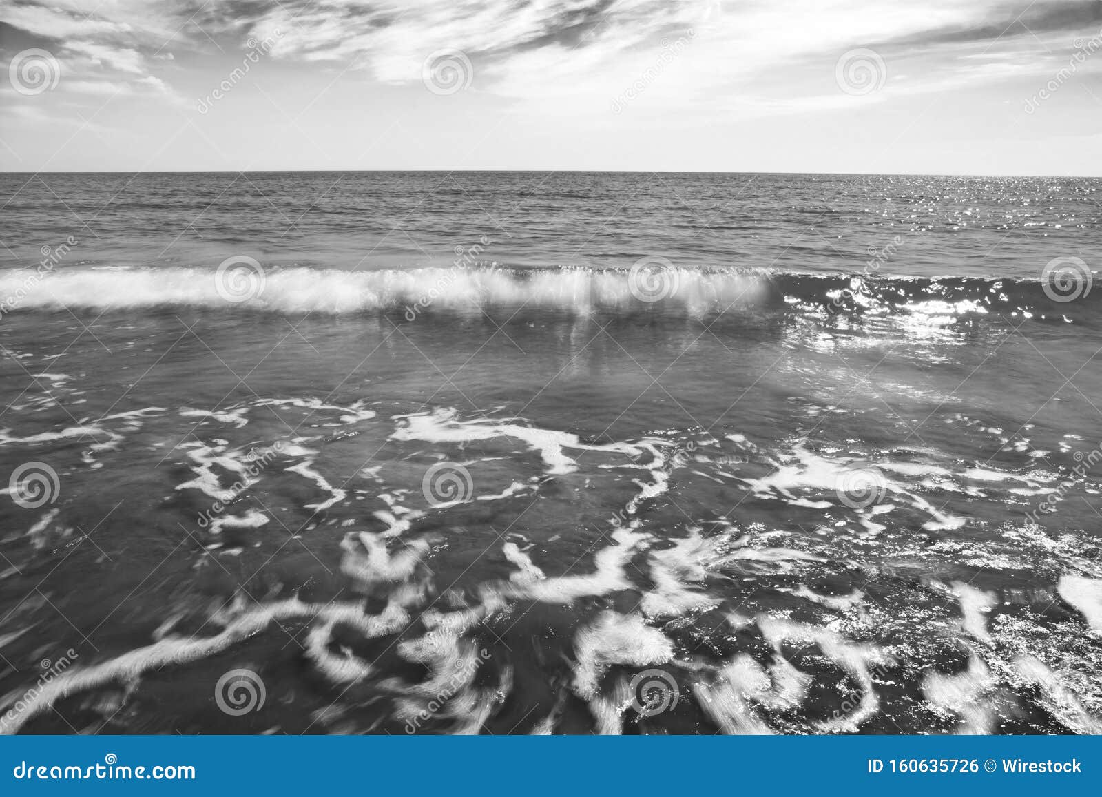 Greyscale Shot of the Crazy Sea Waves Under the Dark Cloudy Sky Stock ...