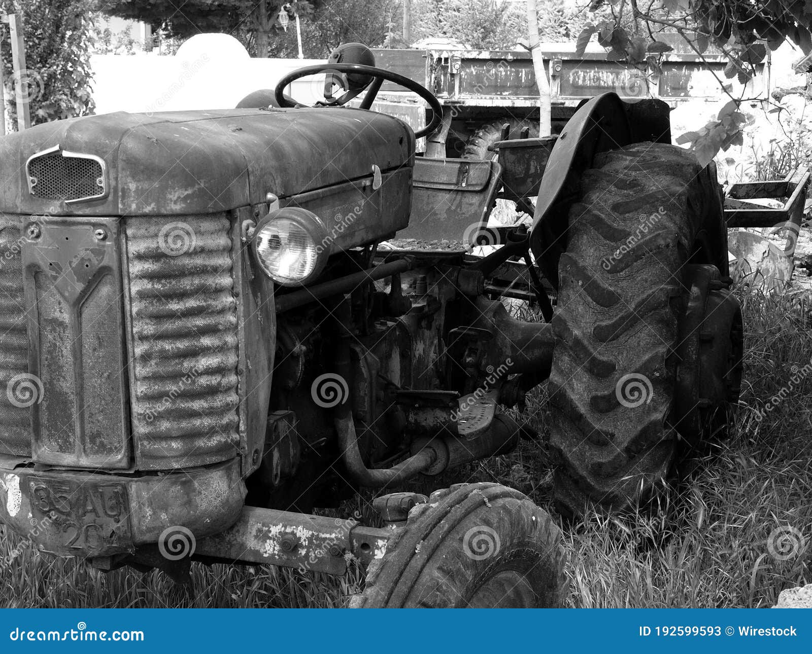 Greyscale Shot of an Old Tractor in a Field Stock Image - Image of wall ...