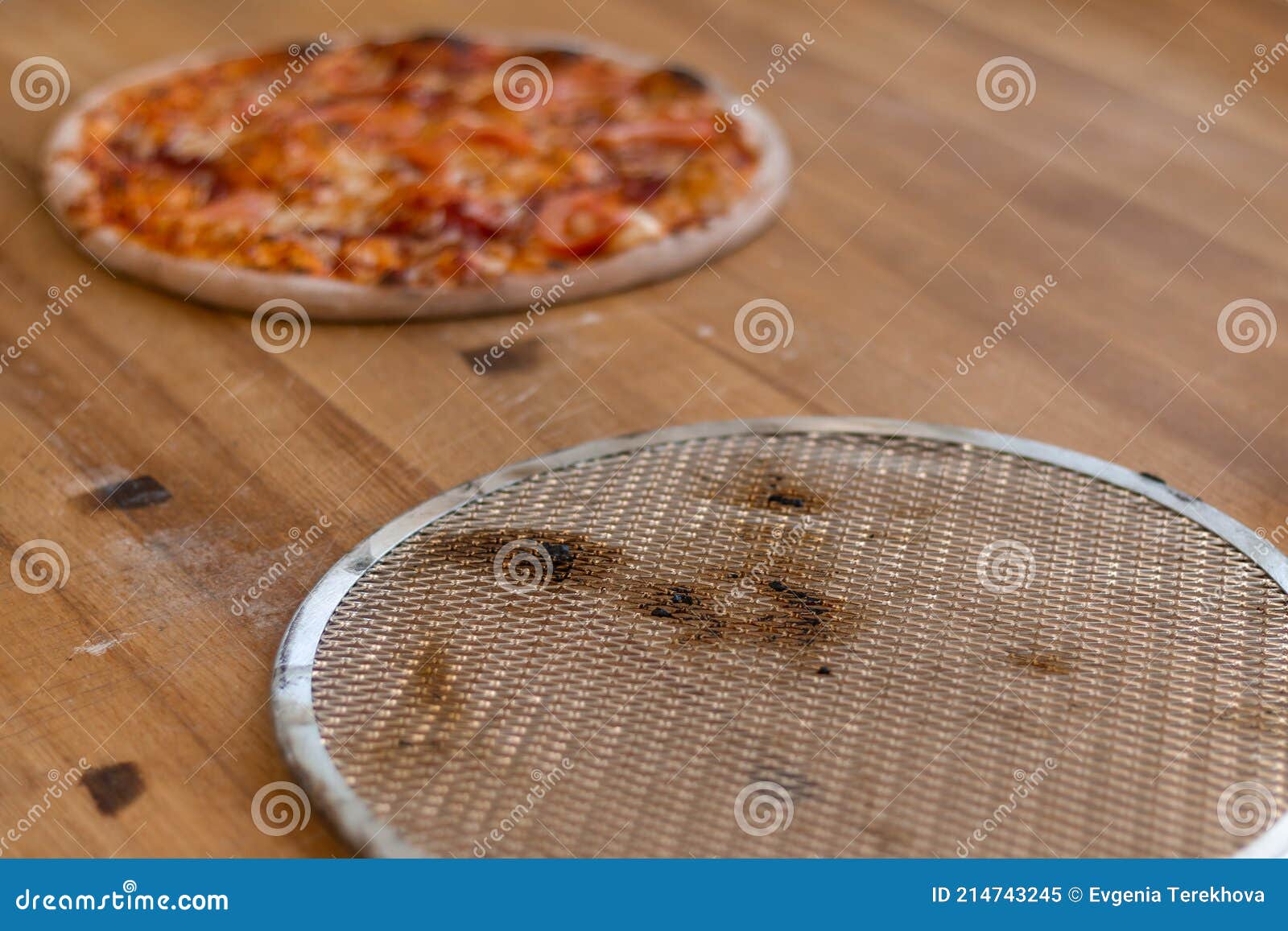 Grid for Baking Pizza on a Cutting Board on the Background of Cooked ...