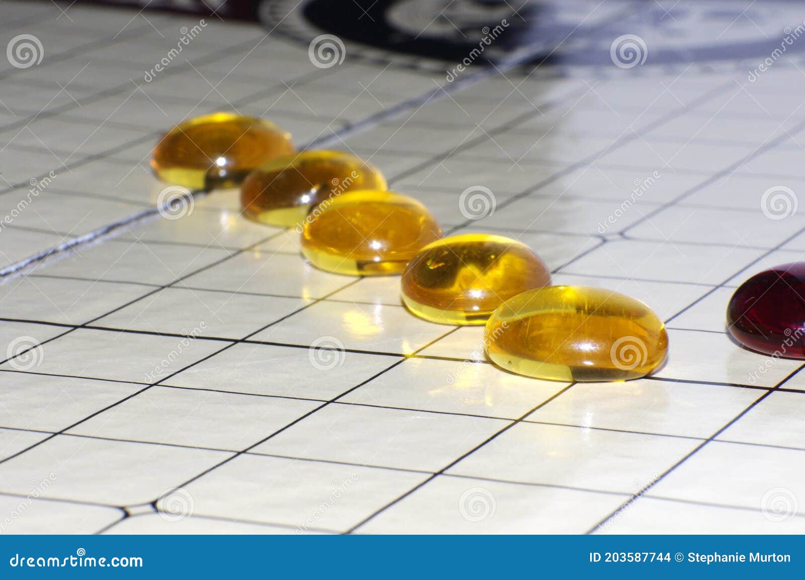 Grid Game Board with Yellow Glass Movers Stock Photo - Image of earth ...
