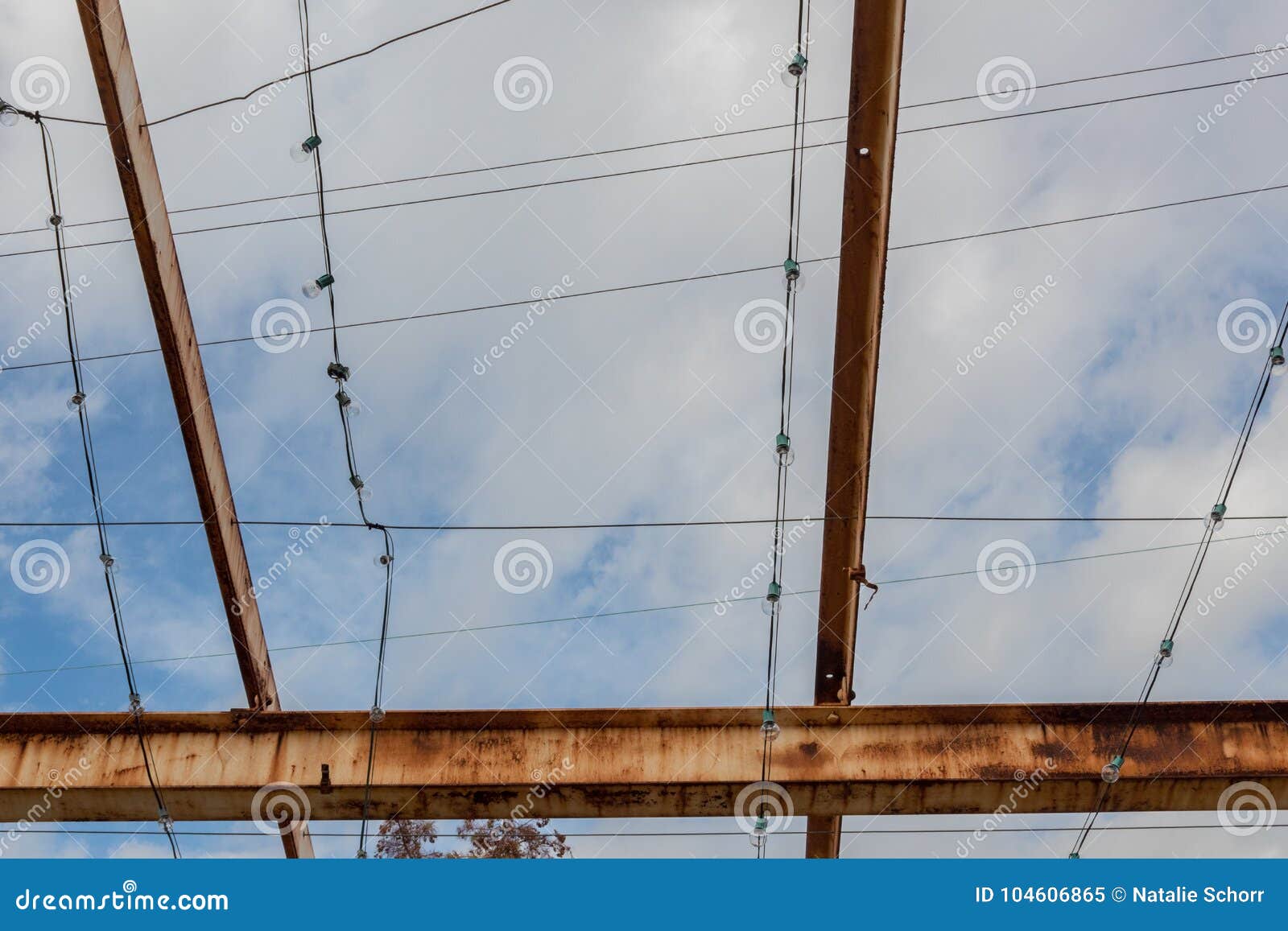 Gridwork of Overhead Beams, Painted and Rusted, Against a Blue Sky ...