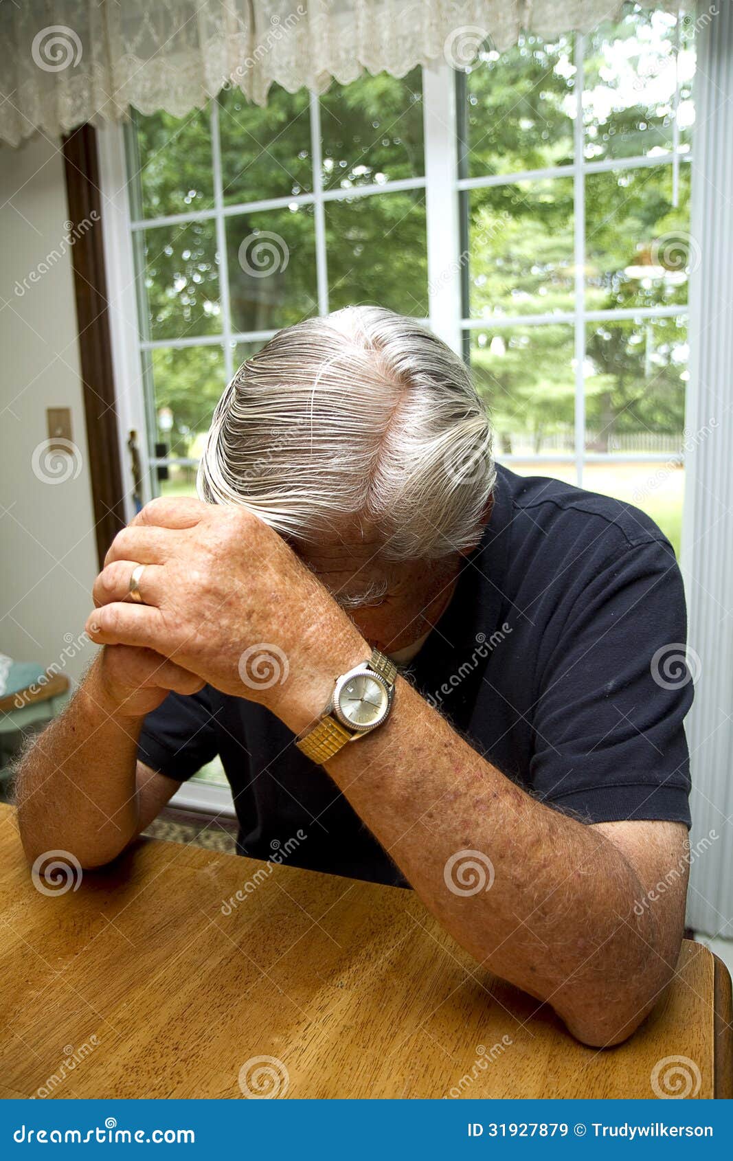 Grieving Man at Table stock image. Image of hands, citizen - 31927879