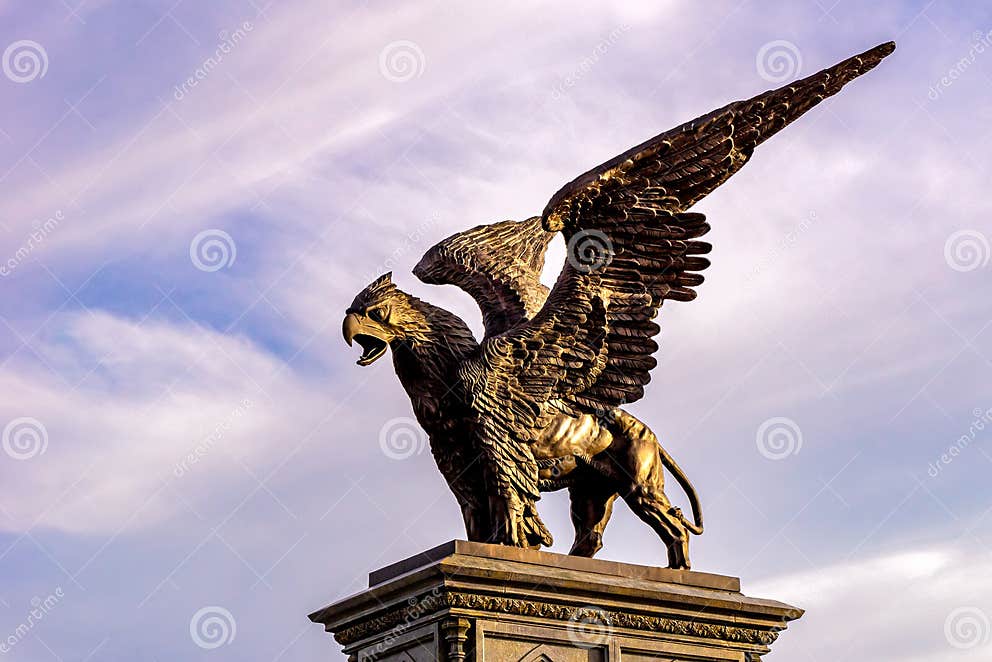 Griffon Statue Against the Background of the Evening Sky, Selective ...