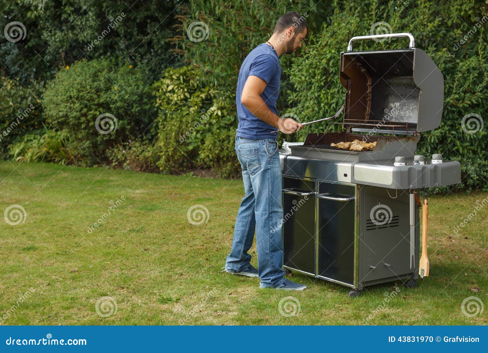 Grill cooking out stock photo. Image of shirt, grill - 43831970
