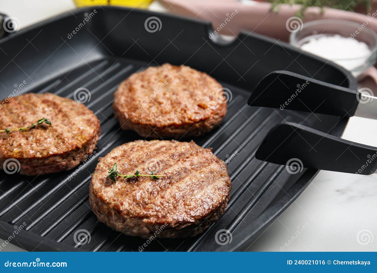Grill Pan with Tasty Fried Hamburger Patties on White Table Stock Photo ...