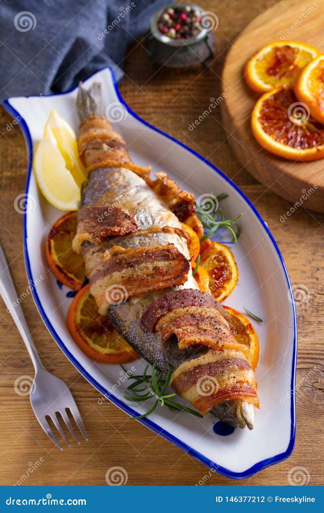 Grilled Bacon-Wrapped Whitefish. Fish Wrapped with Bacon. Stock Photo ...