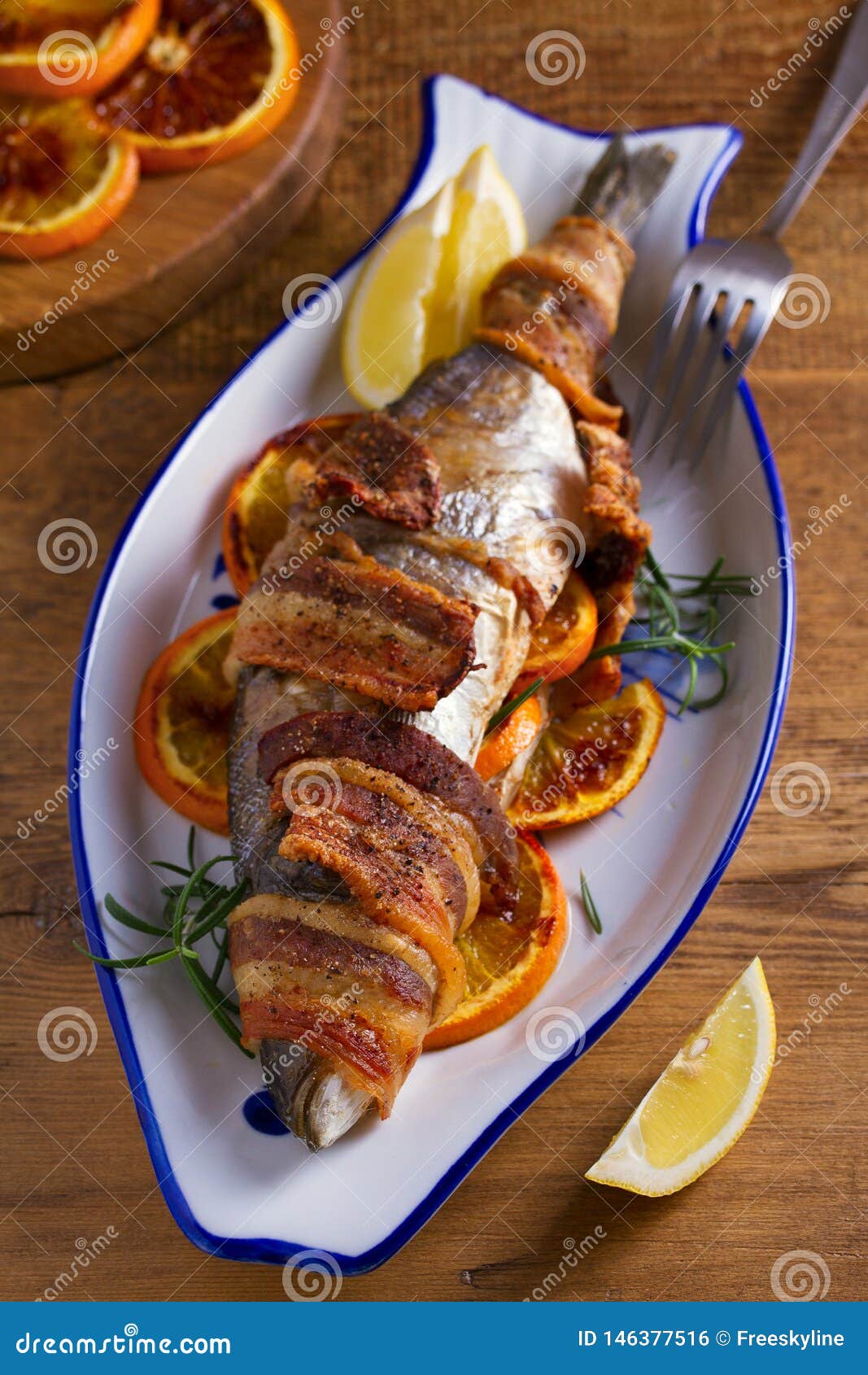 Grilled Bacon-Wrapped Whitefish. Fish Wrapped with Bacon. Stock Photo ...