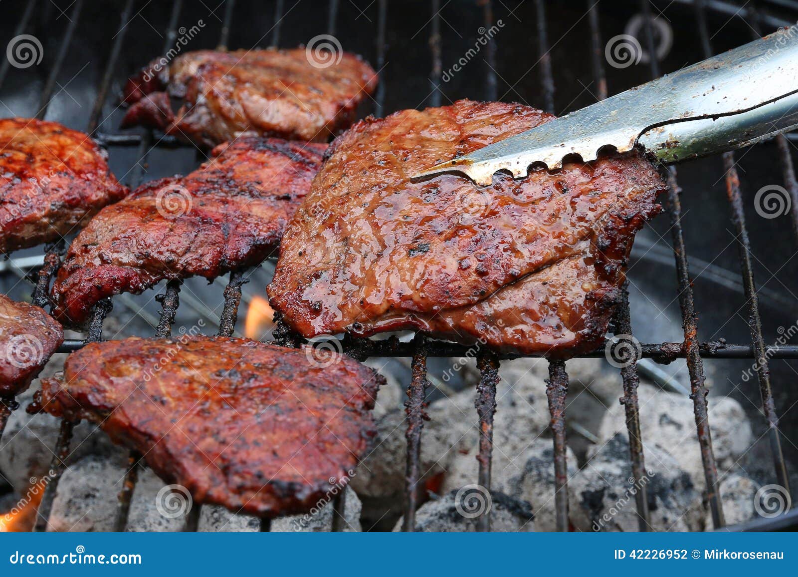 Grilled Beef Steaks on BBQ Grill Stock Photo - Image of green, lighting ...