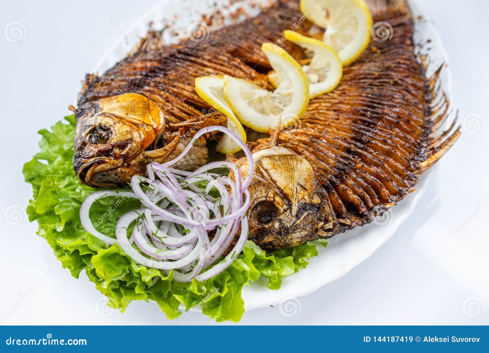 Grilled Carp Fish on the White Plate Over White Stock Image - Image of ...