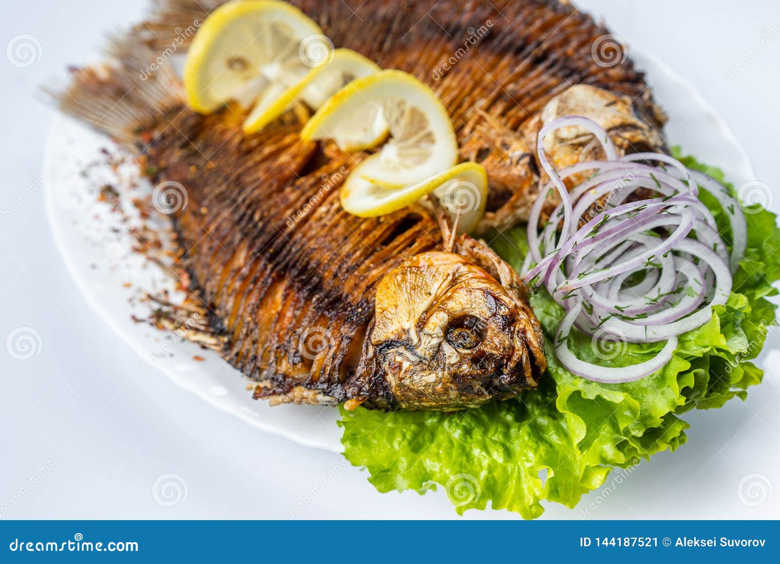 Grilled Carp Fish on the White Plate Over White Stock Image - Image of ...