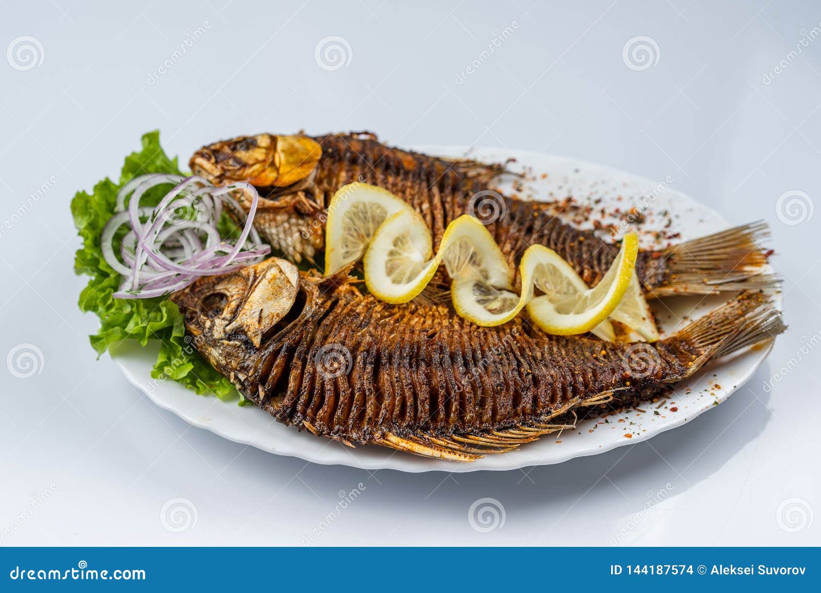 Grilled Carp Fish on the White Plate Over White Stock Photo - Image of ...